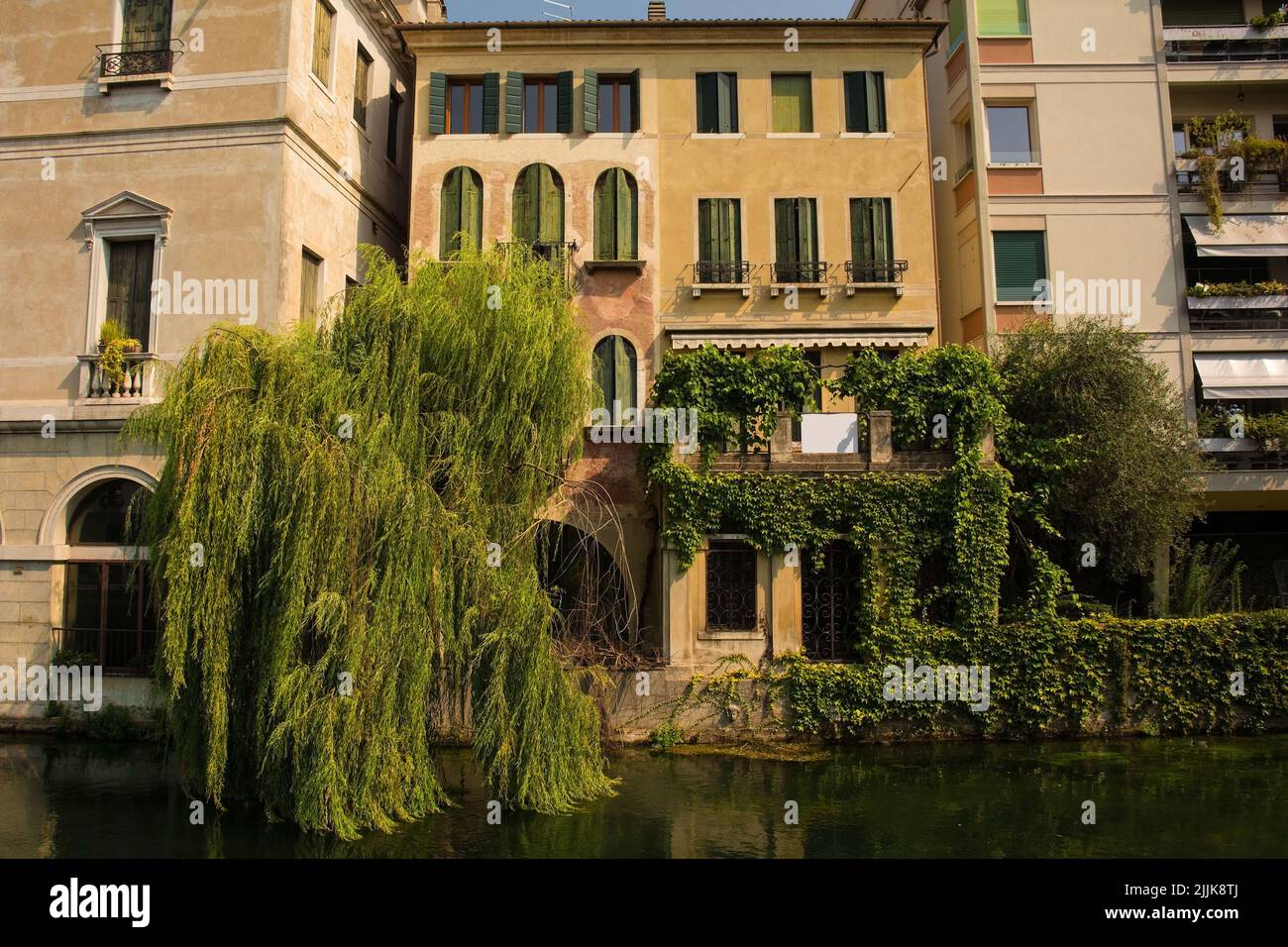 Houses line the banks of the Sile River as it flows through the ...