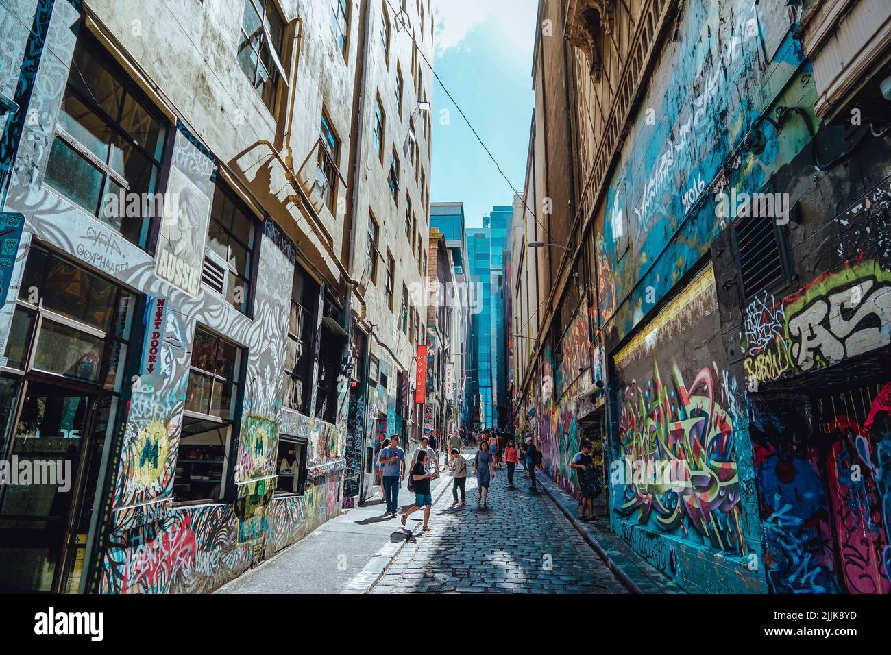 People admiring the art of Melbourne's world-renowned street art scene ...