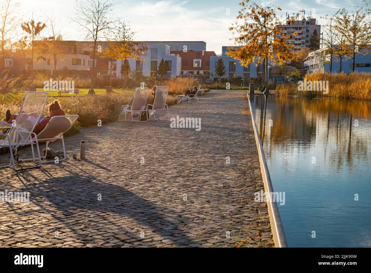 People Relaxing in SuedparkLandau, Rheinland-Pfalz, Germany at sunset ...