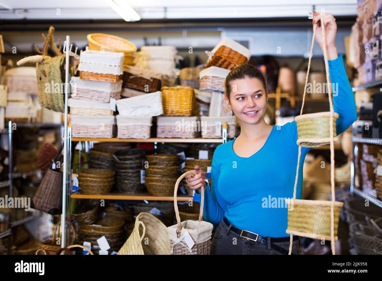 customer standing with wicker basket Stock Photo - Alamy