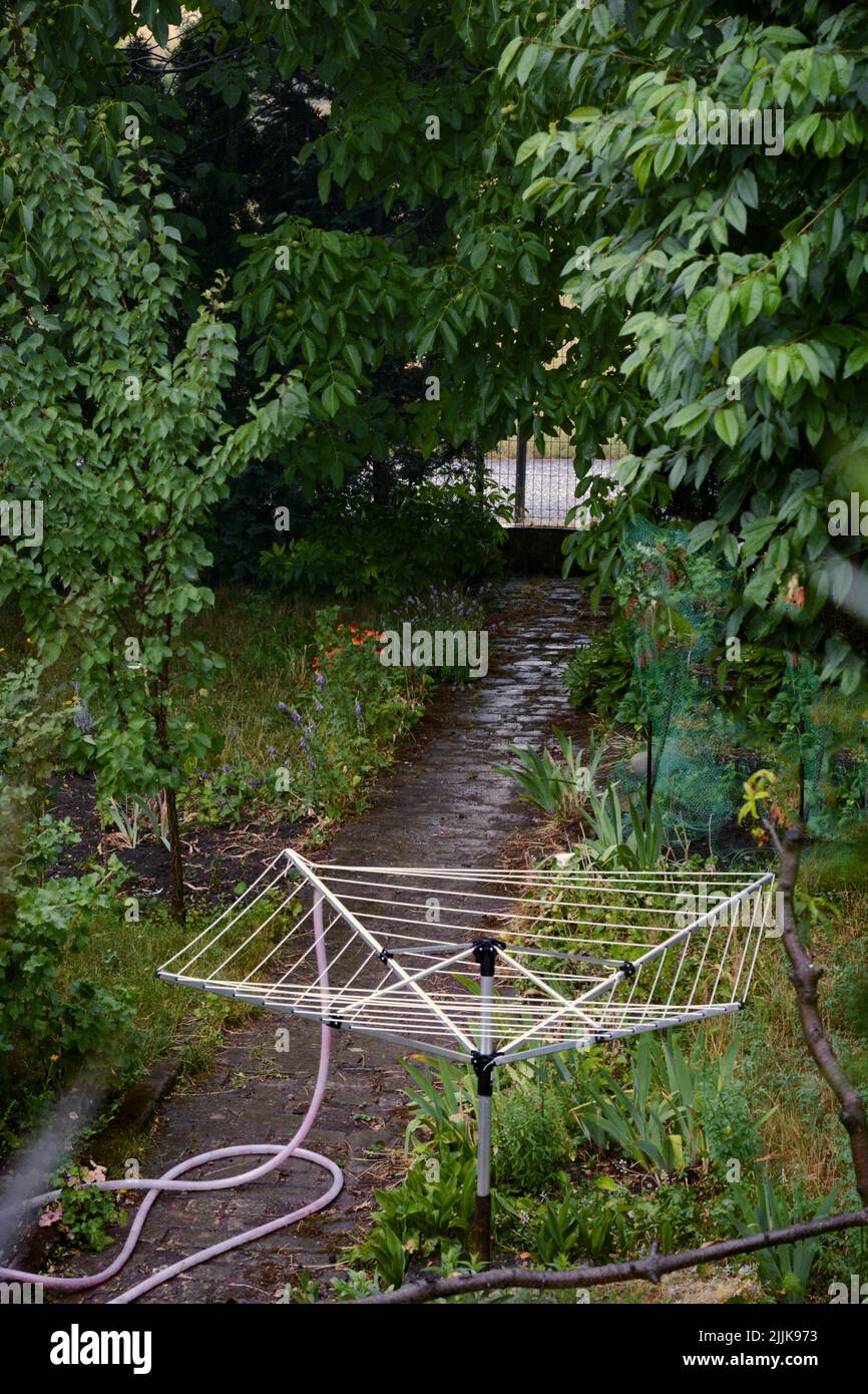 A garden in a village in the morning after rain Stock Photo - Alamy