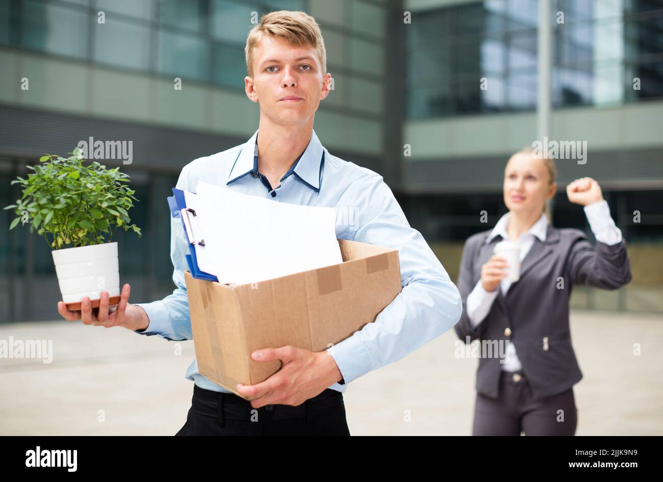 Businesswoman is wishing good luck to worker Stock Photo - Alamy