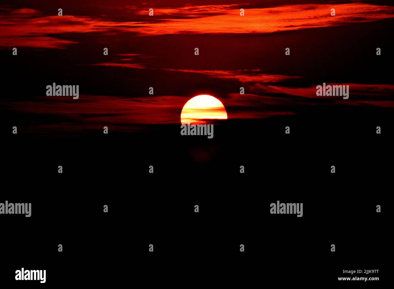 A scenic view of a rising sun in the morning Stock Photo - Alamy