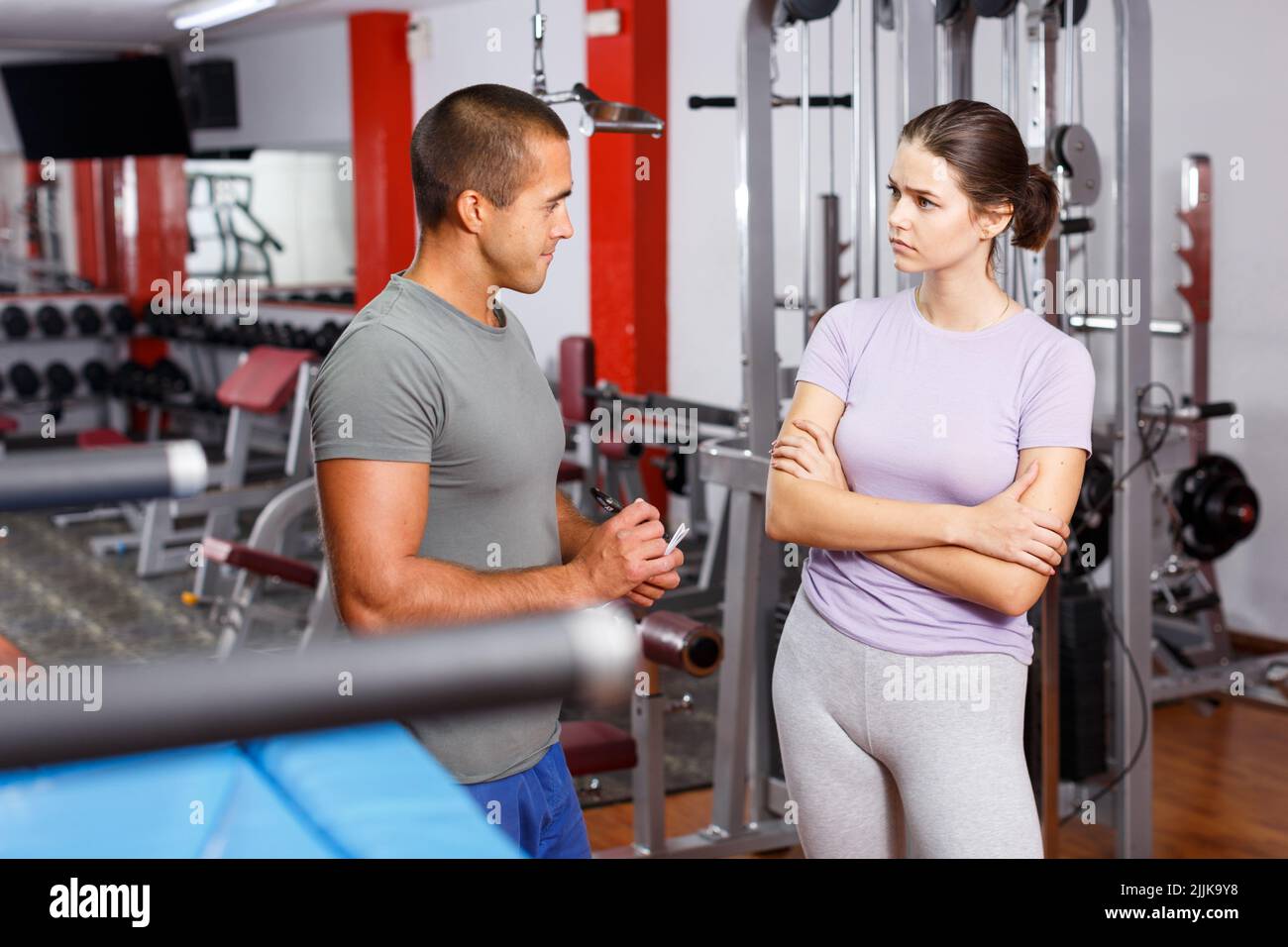 Athlete man help young woman hi-res stock photography and images - Alamy