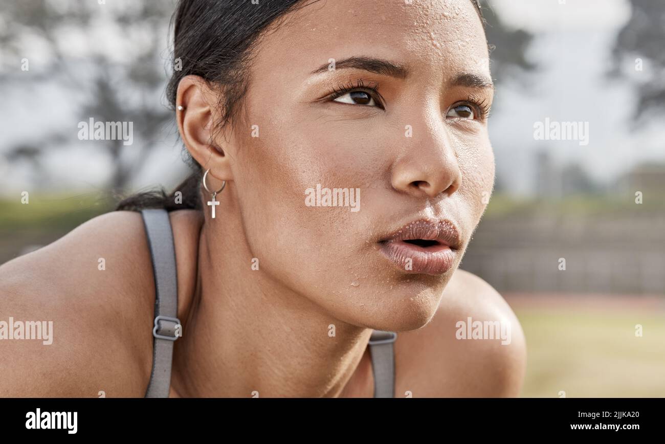 Rest but dont you dare quit. a young woman catching her breath while ...