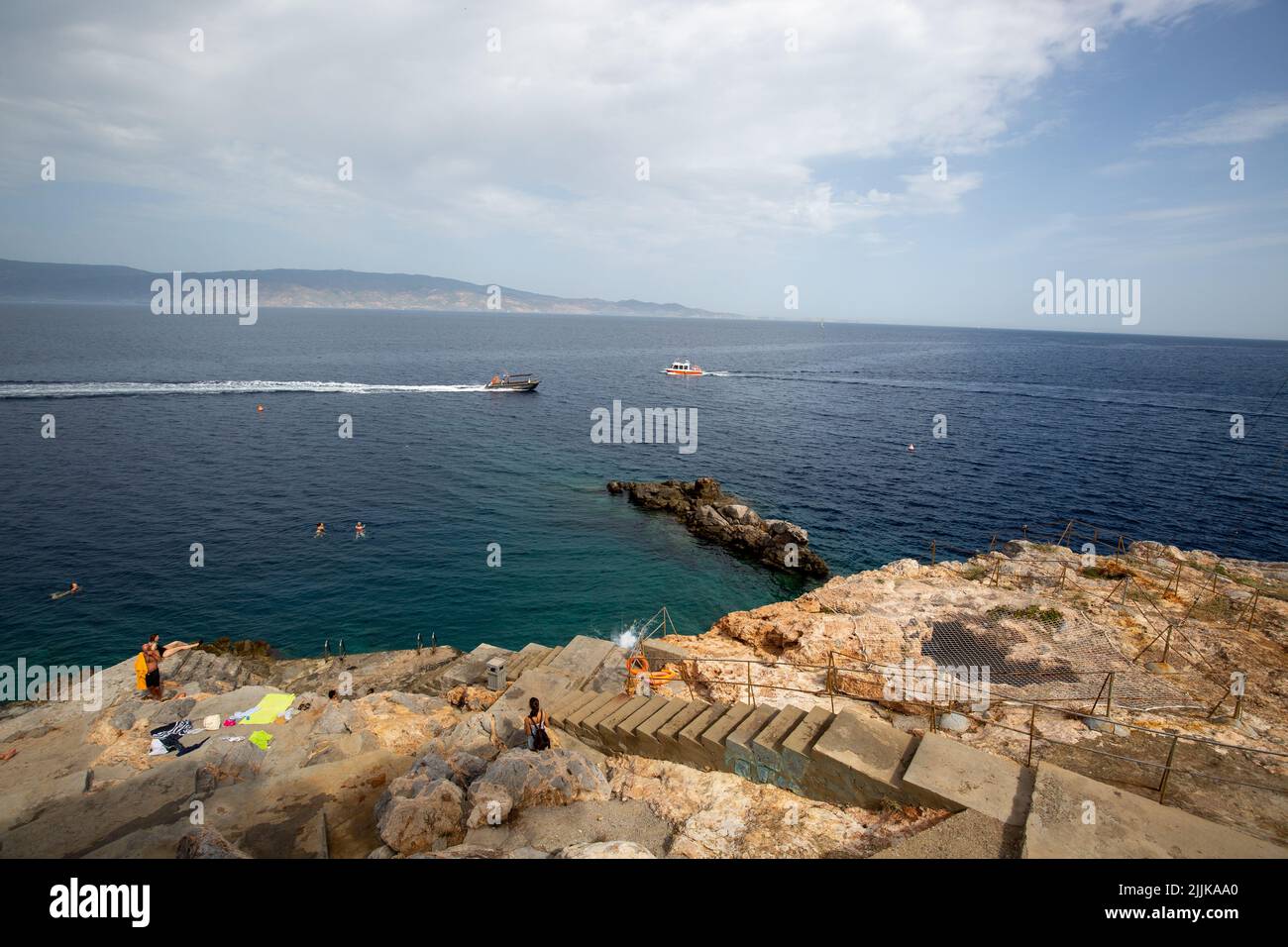 A natural view of yatch and boats on the coast of Hydra island in ...
