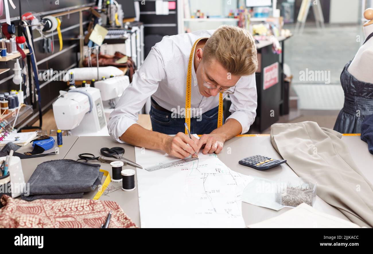 Dressmaker at work – creating pattern Stock Photo - Alamy