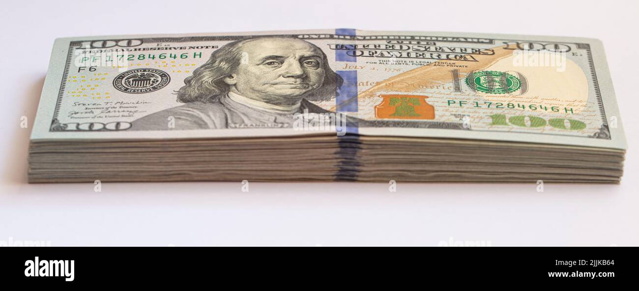 Pile of 100 dollar banknotes on white background for design purpose ...
