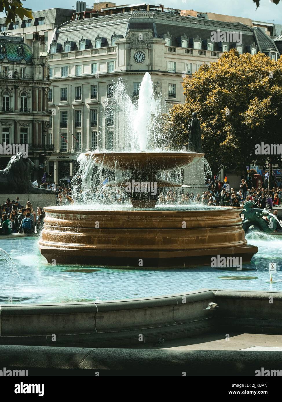 A photo of the fountain of Trafalgar Square in London, United Kingdom ...