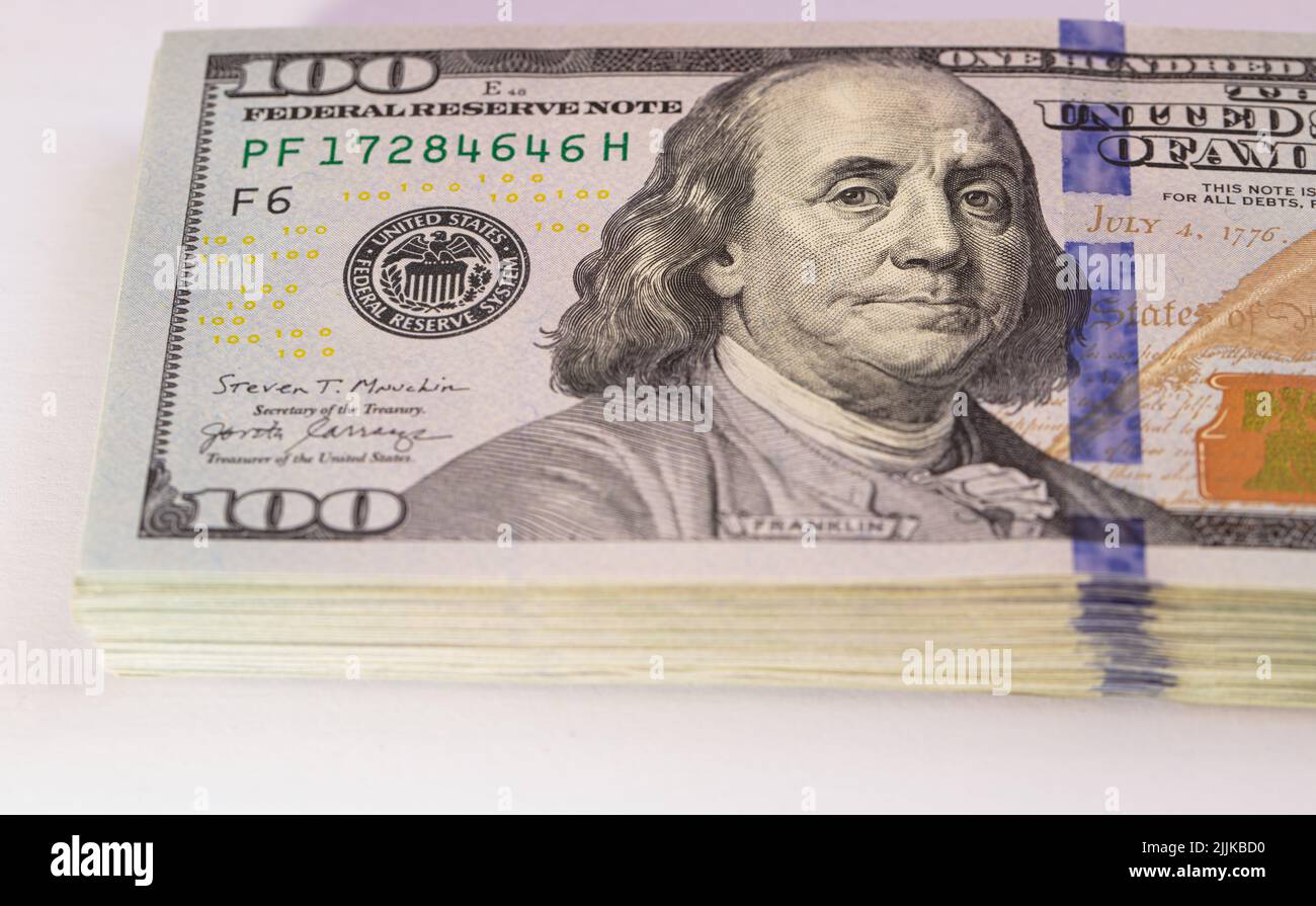 Pile of 100 dollar banknotes on white background for design purpose ...