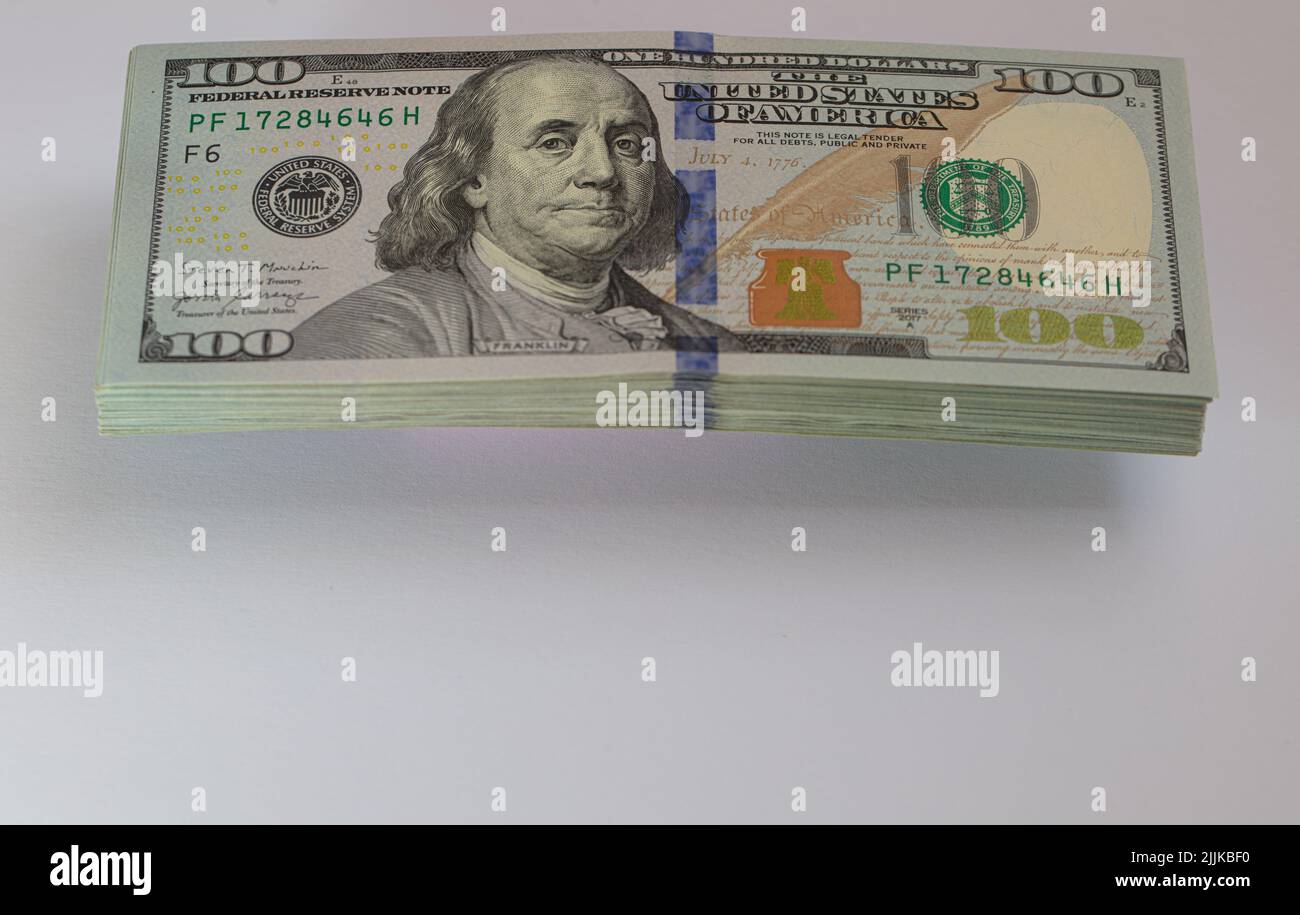 Pile of 100 dollar banknotes on white background for design purpose ...