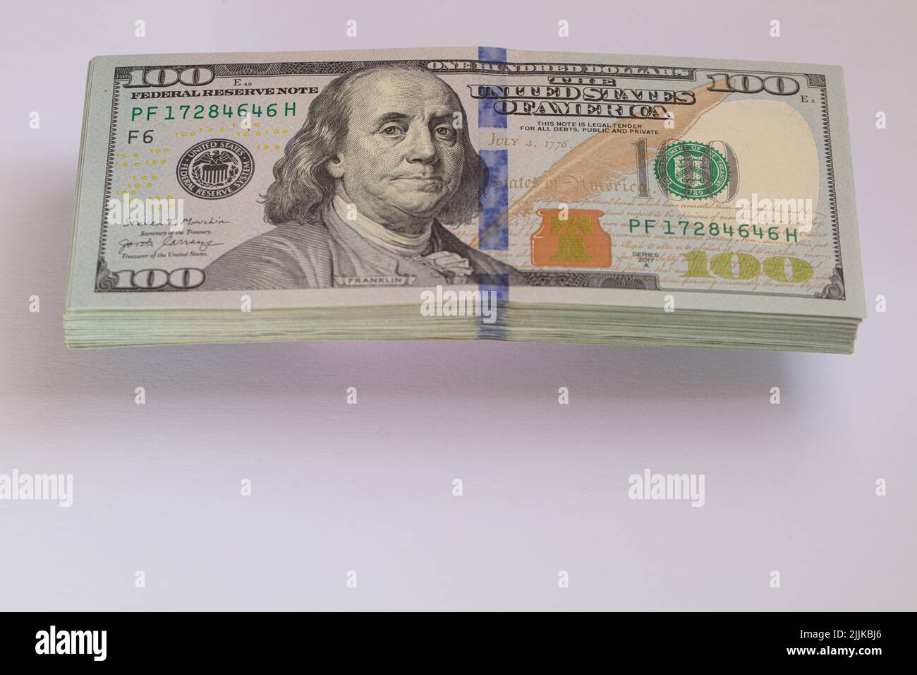 Pile of 100 dollar banknotes on white background for design purpose ...