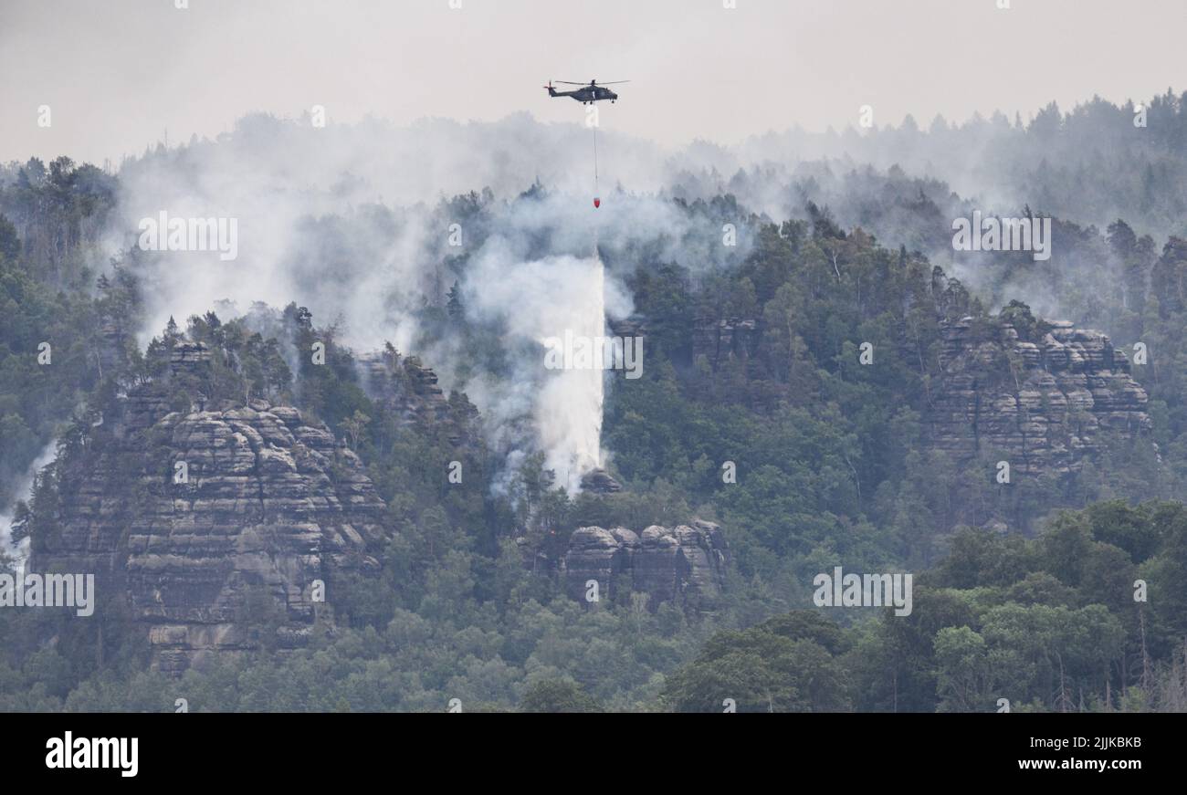 Schmilka, Germany. 27th July, 2022. A Bundeswehr helicopter flies with ...