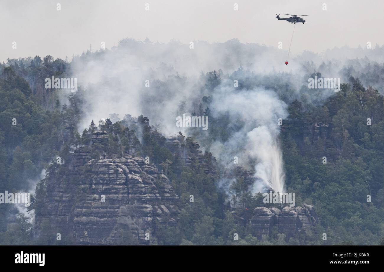 Schmilka, Germany. 27th July, 2022. A Bundeswehr helicopter flies with ...