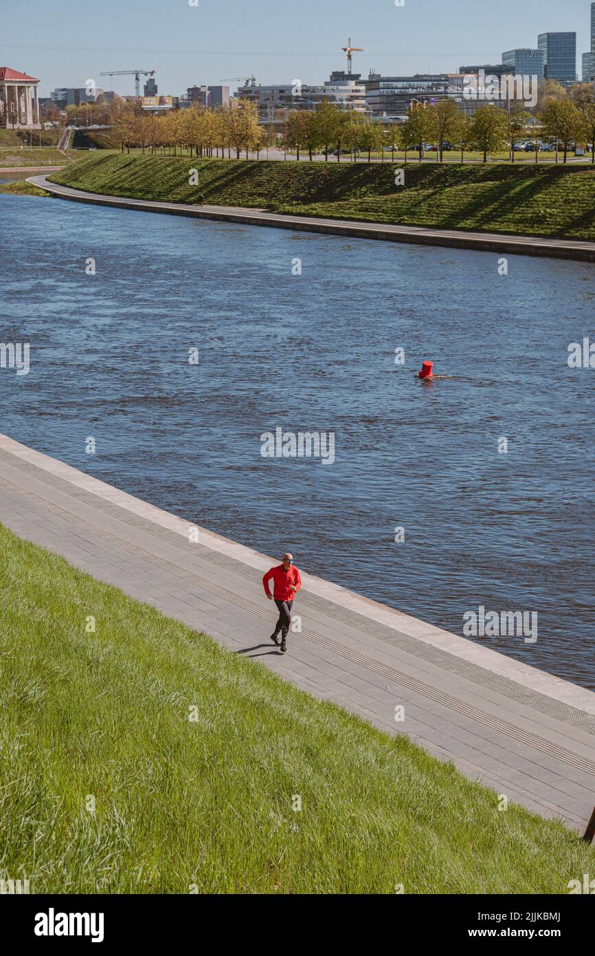 Man running in nature near a lake hi-res stock photography and images ...
