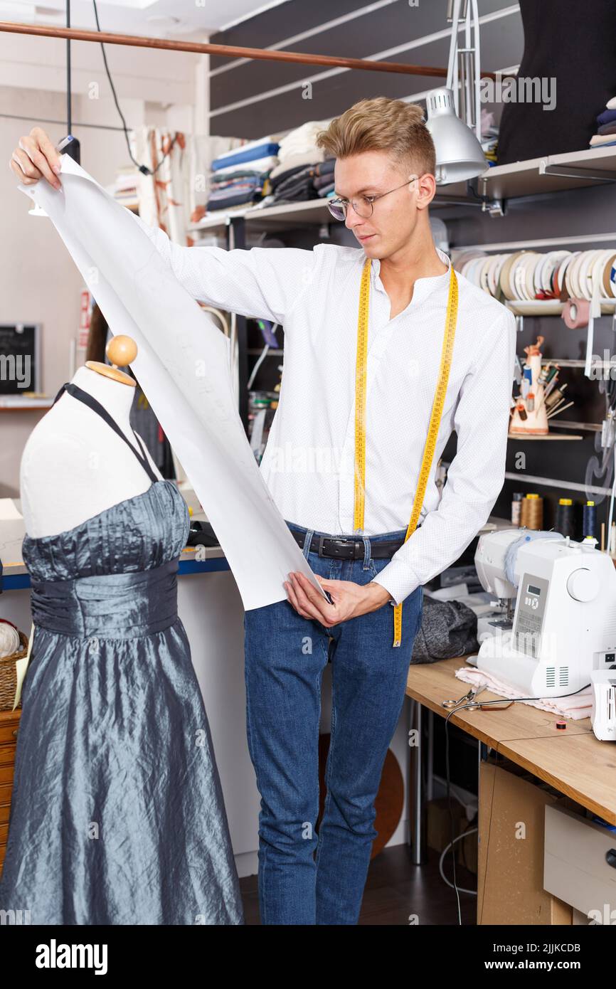 Dressmaker at work – creating dress style Stock Photo - Alamy