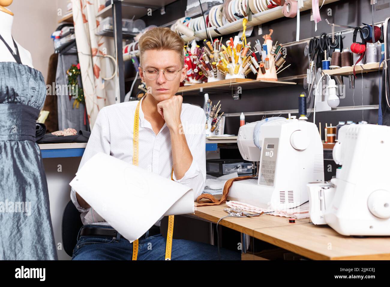 Tailor designing dress style Stock Photo - Alamy