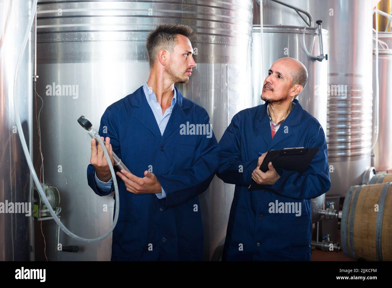 experts men standing with clipboard Stock Photo - Alamy