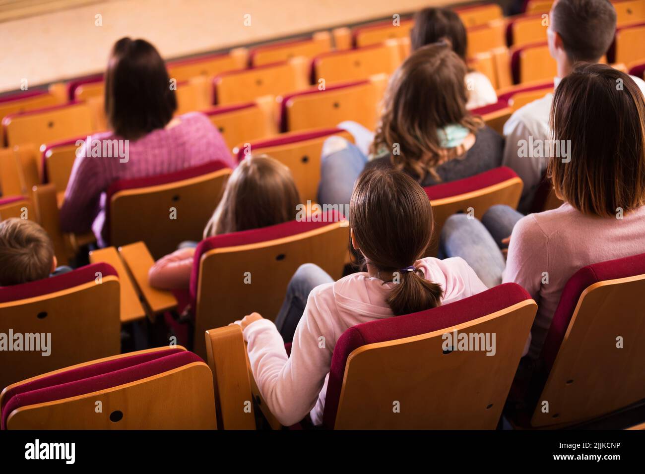 People waiting for movie Stock Photo - Alamy