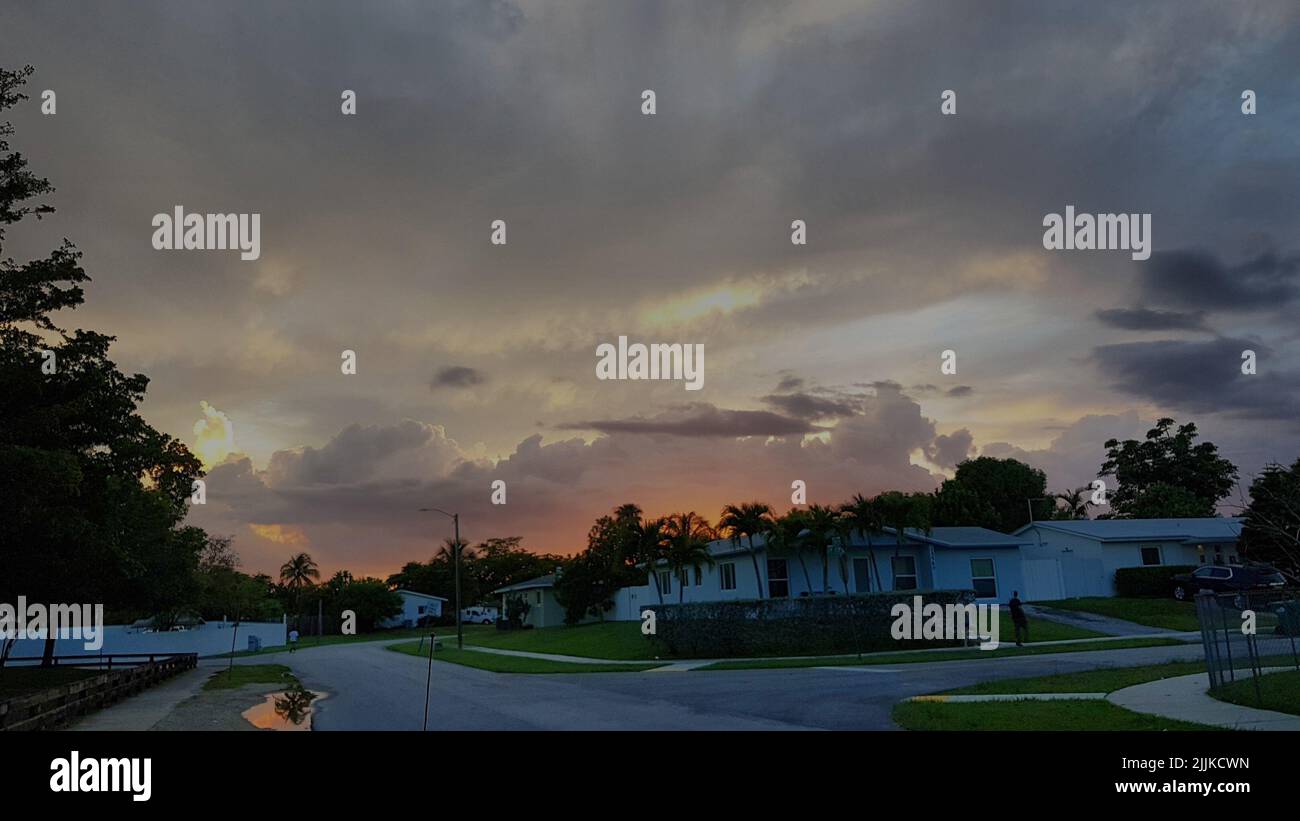 A residential area under a cloudy sunset sky in Miami, USA Stock Photo ...