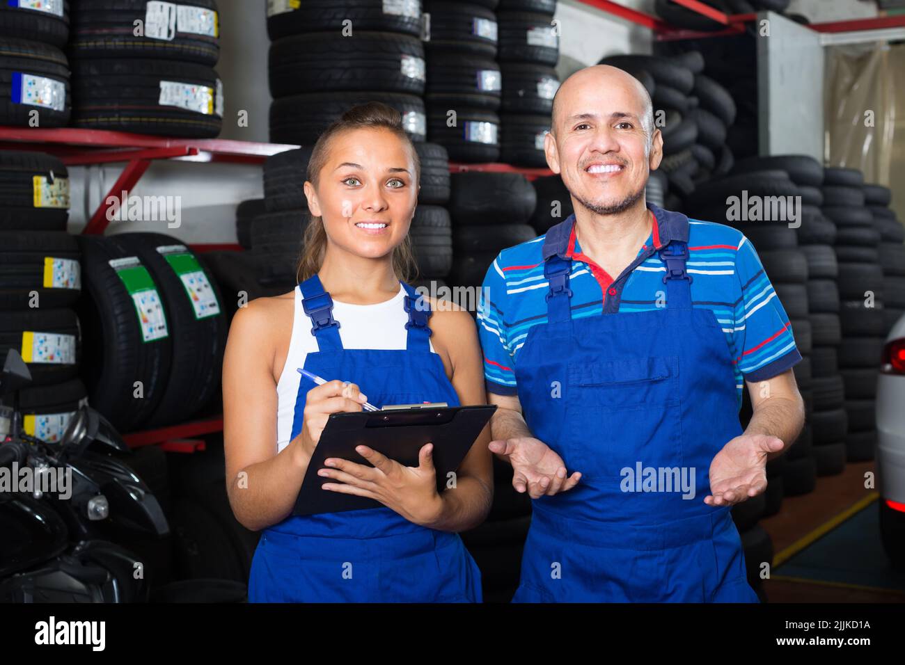 Mechanics adjusting engine hi-res stock photography and images - Alamy