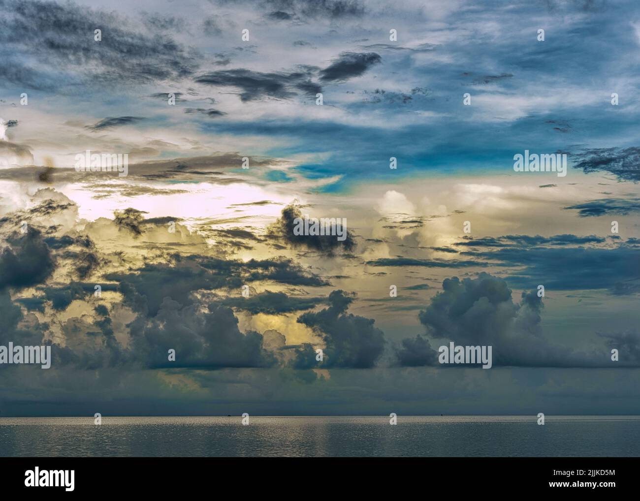 The ocean under a cloudy sunset sky at Deering Bay, Miami Stock Photo ...