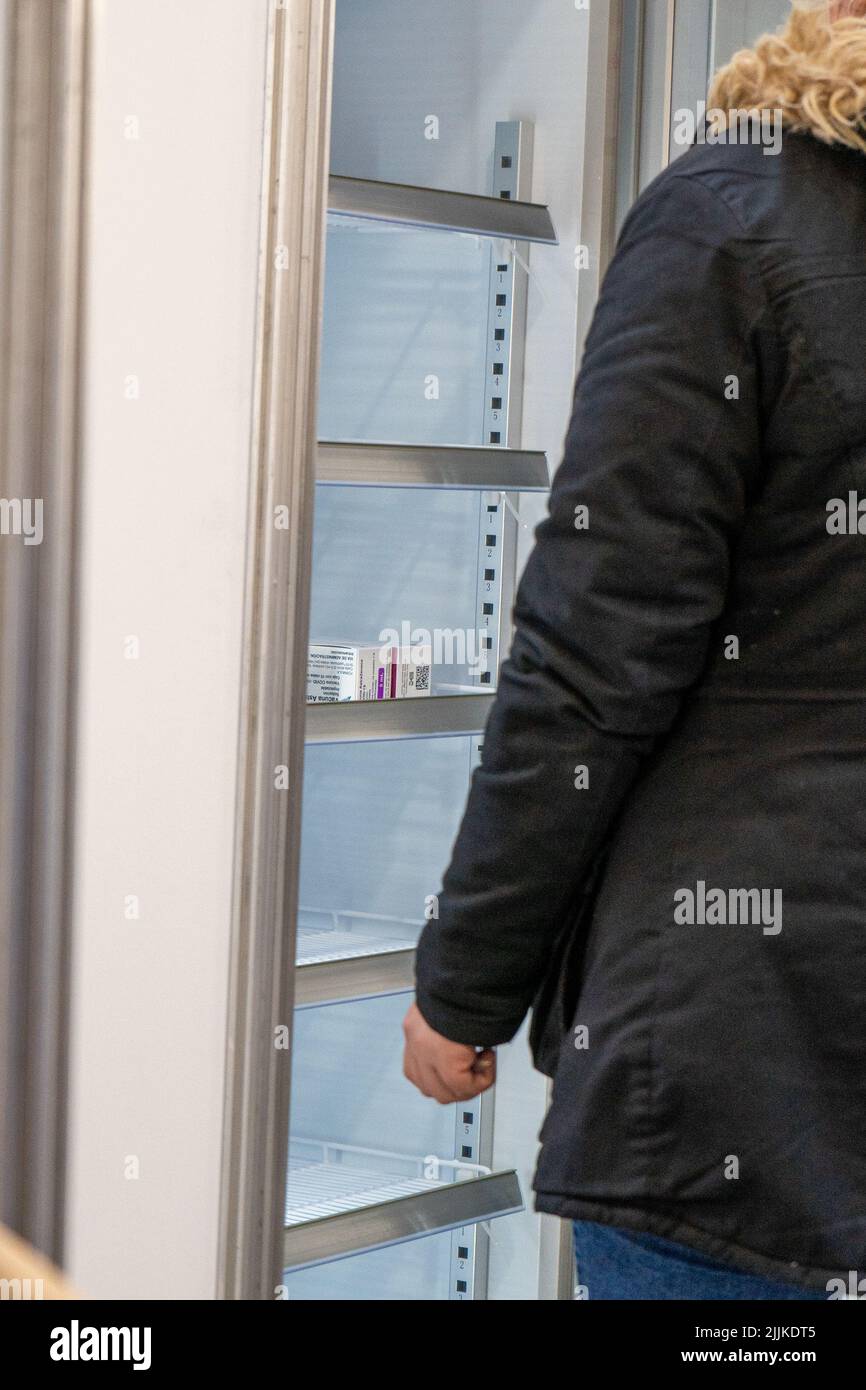 Vertical photograph of the back of a person standing in front of a ...
