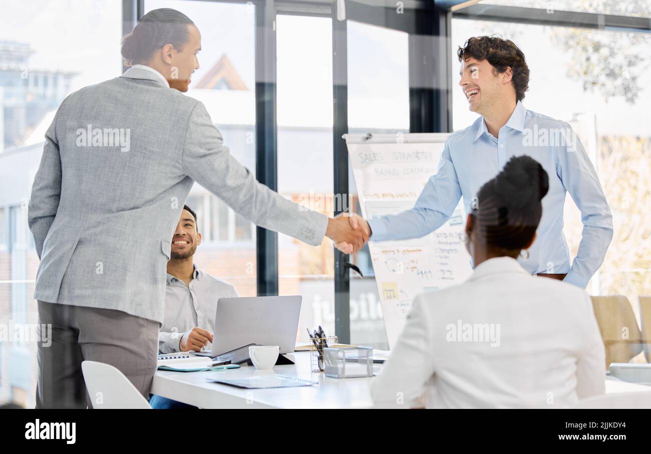 Making their meeting work with teamwork. a group of people having a ...