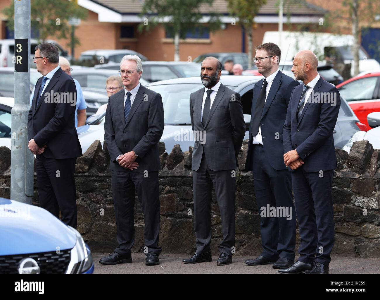 Buta Atwal (centre), Chief Executive of Wrightbus, outside the ...
