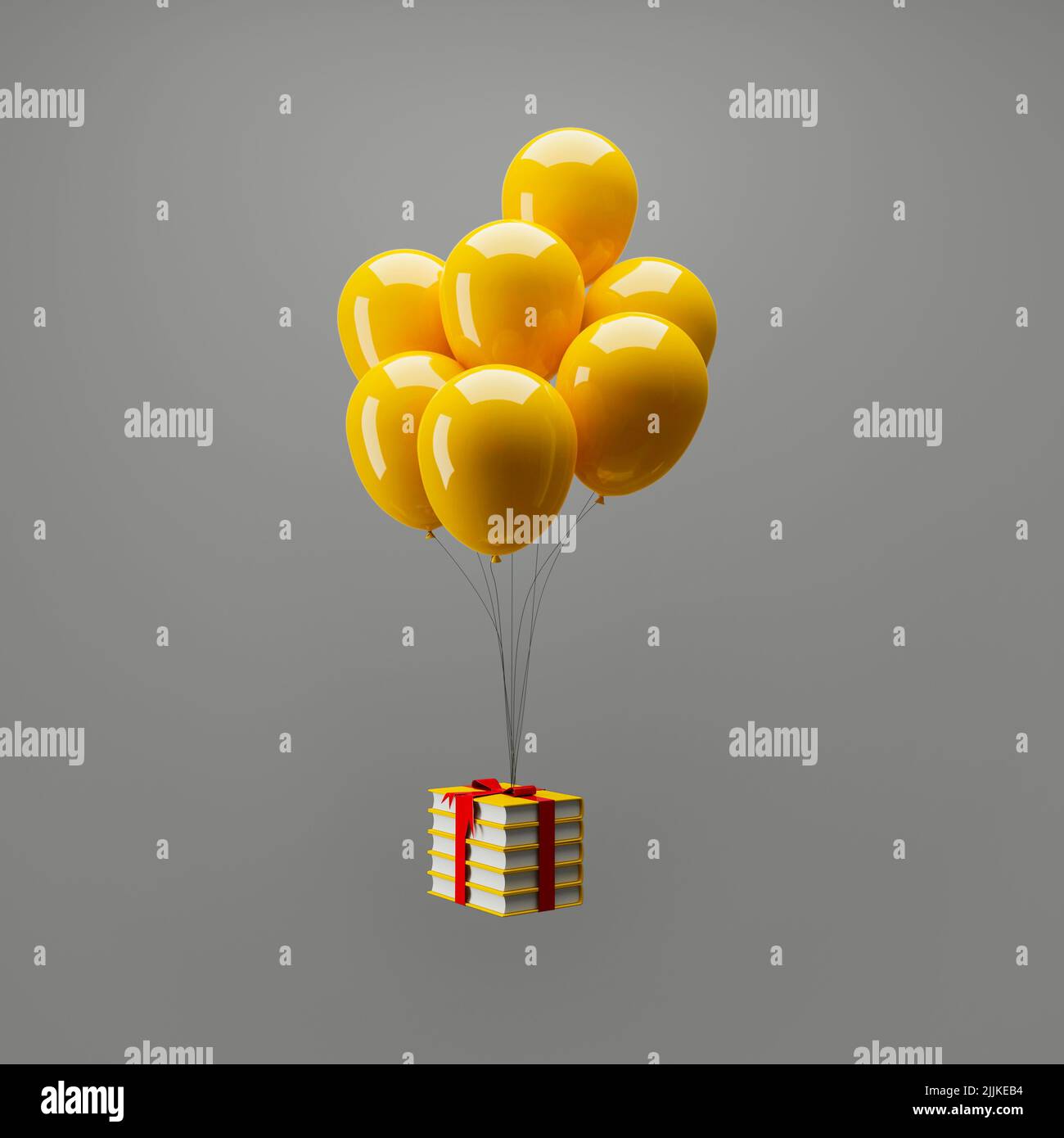 Stack of yellow books tied with ribbon flies on balloons on gray ...