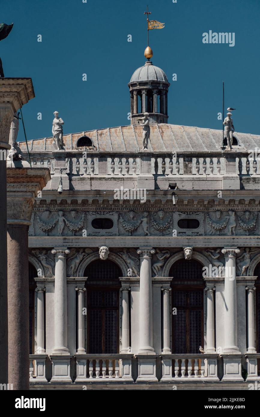 A vertical shot of the Library of Saint Mark's facade with dome ...