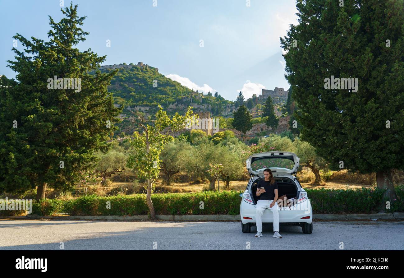 Man on road trip Stock Photo - Alamy