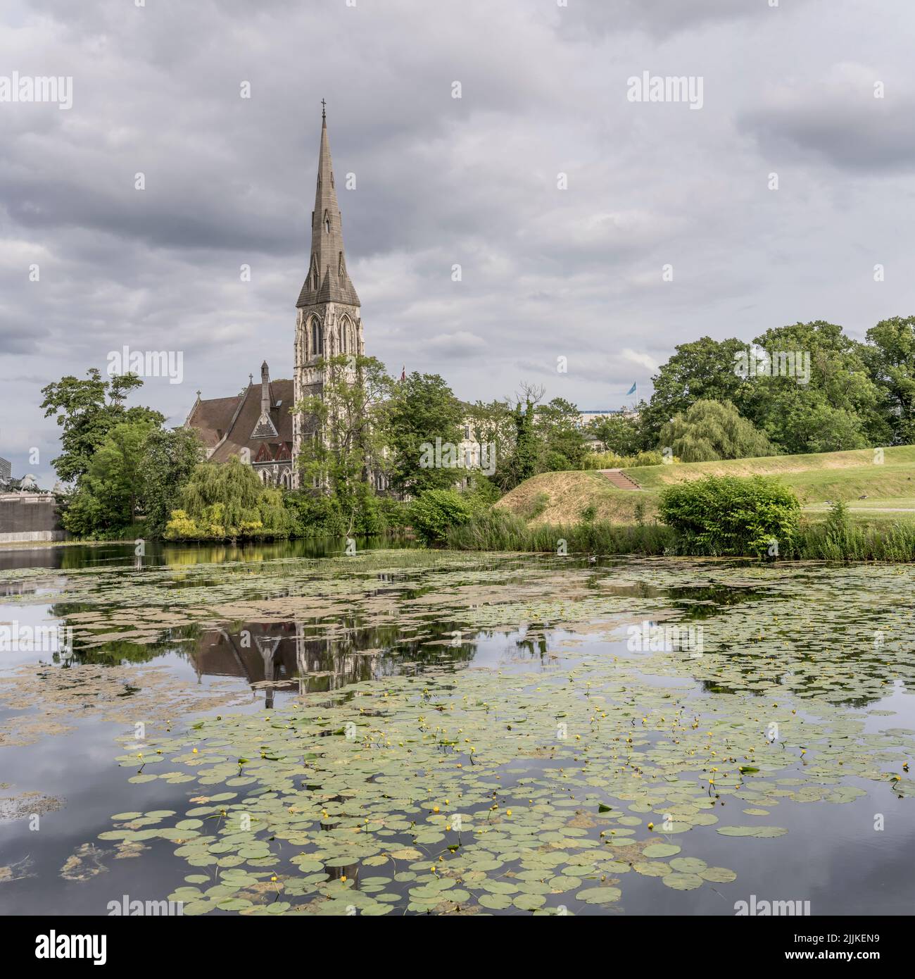 cityscape with Gustavs church reflecting in moat waters at Kastellet ...