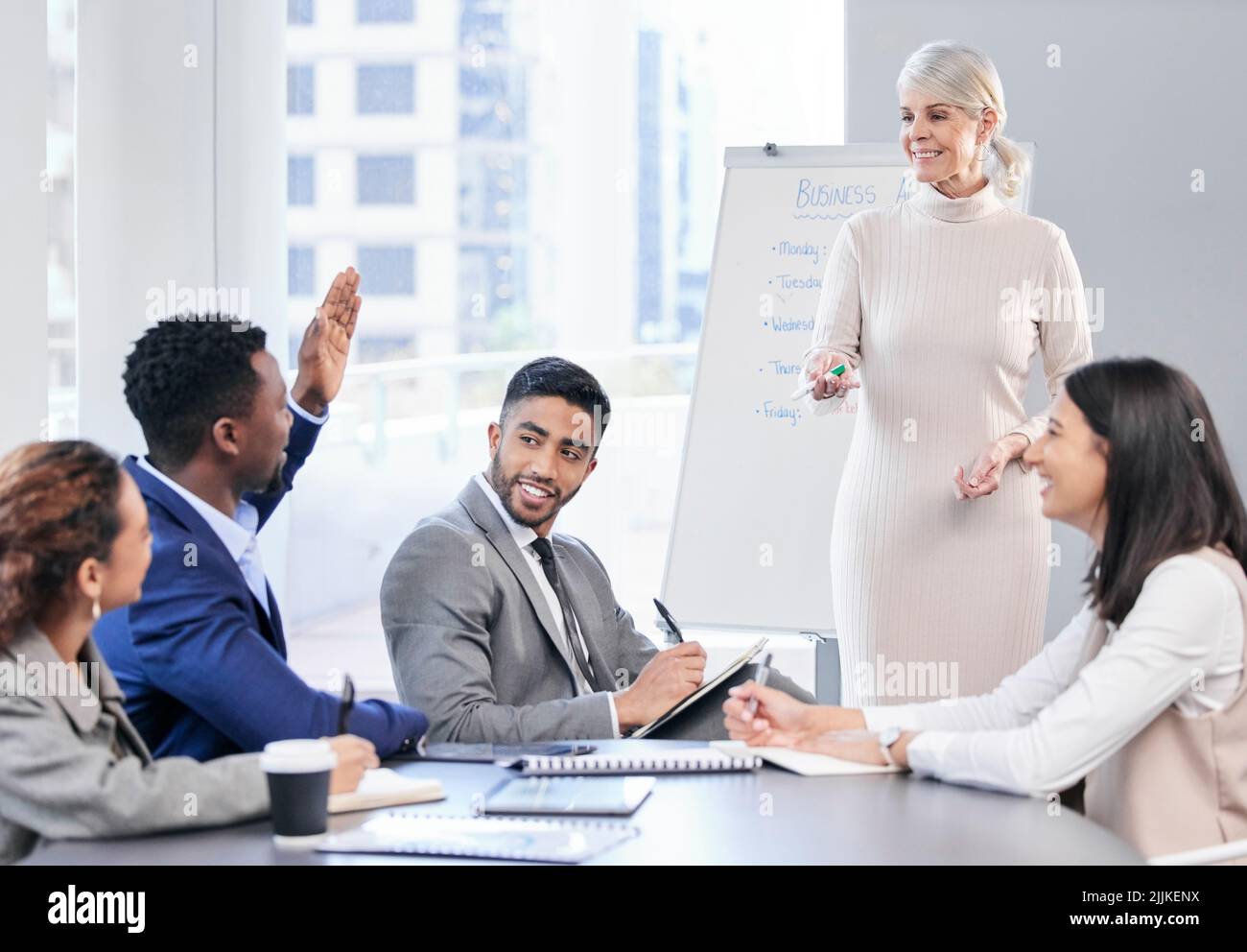 Inspiring the team to do better. a businesswoman giving a presentation ...