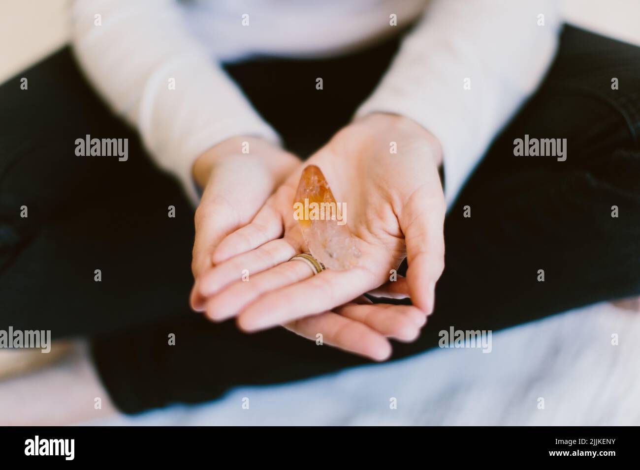 A close-up shot of a woman's hands holding a crystal Stock Photo - Alamy