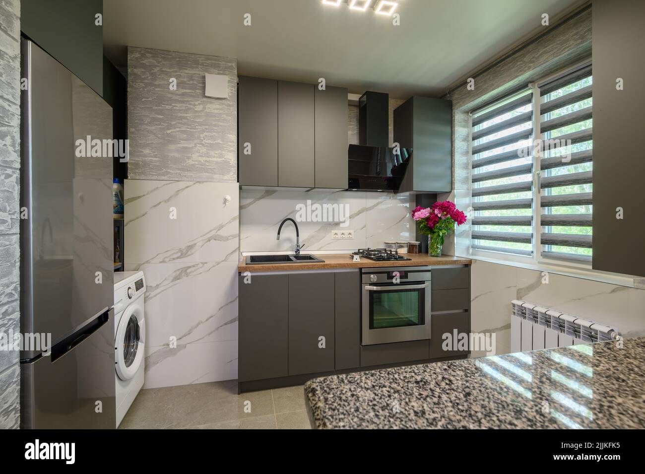 Interior of modern trendy grey kitchen Stock Photo - Alamy