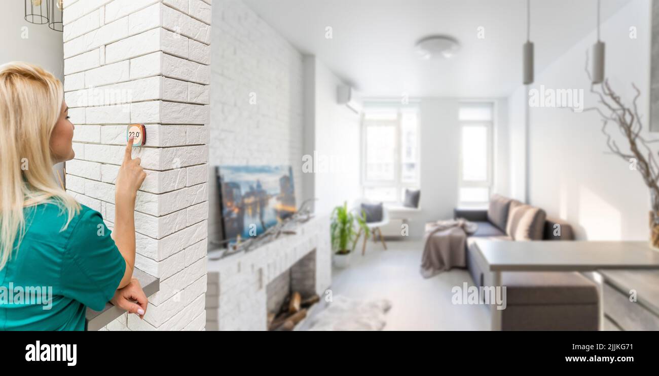 Smart home digital thermostat touch screen woman touching touchscreen ...