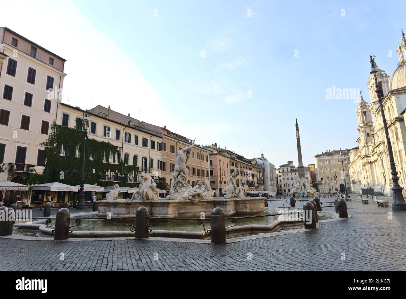 The panoramic low angle shot of Piazza Navona fountain of Neptune, Rome ...