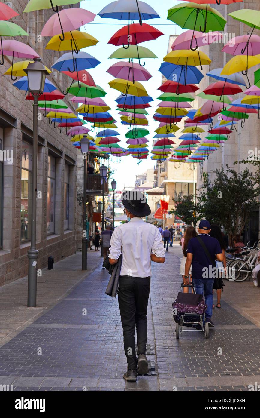 A vertical shot of people walking in Yoel Moshe Solomon Street or the ...