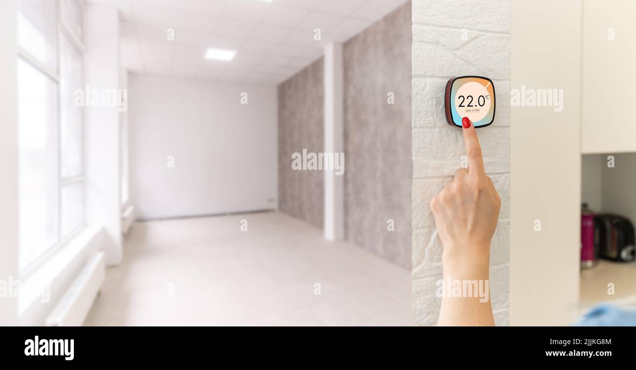 Thermostat smart home domotic control panel on wall for winter house ...