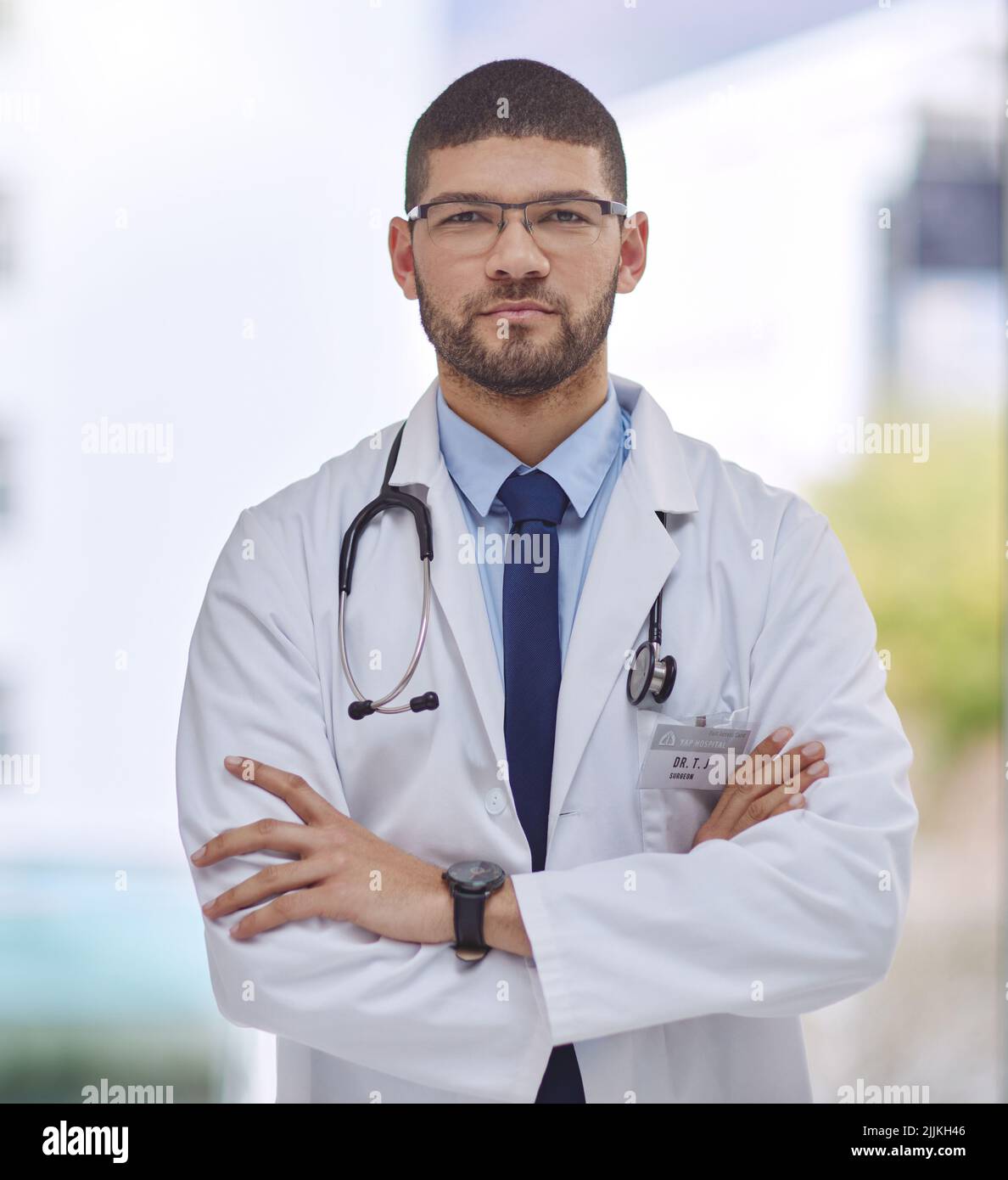 Committed to excellence in healthcare. Portrait of a young doctor standing with his arms crossed ...