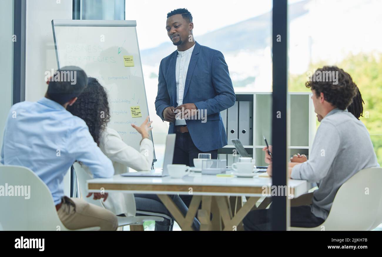 Ive been working on this for ages. a young businessman giving a ...