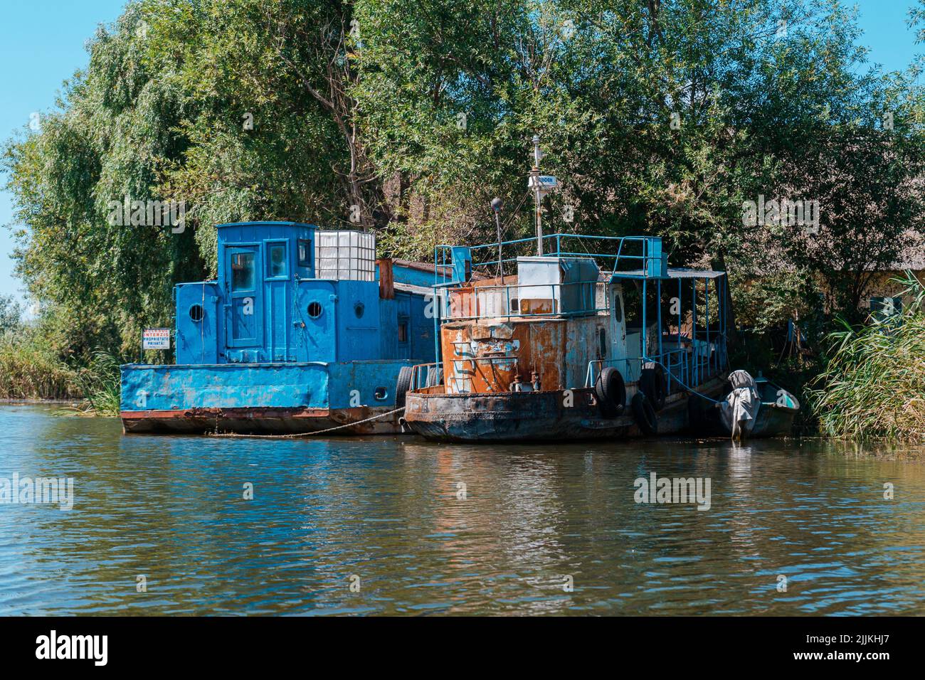 The small ships docking on the canals of The Danube Delta Stock Photo ...