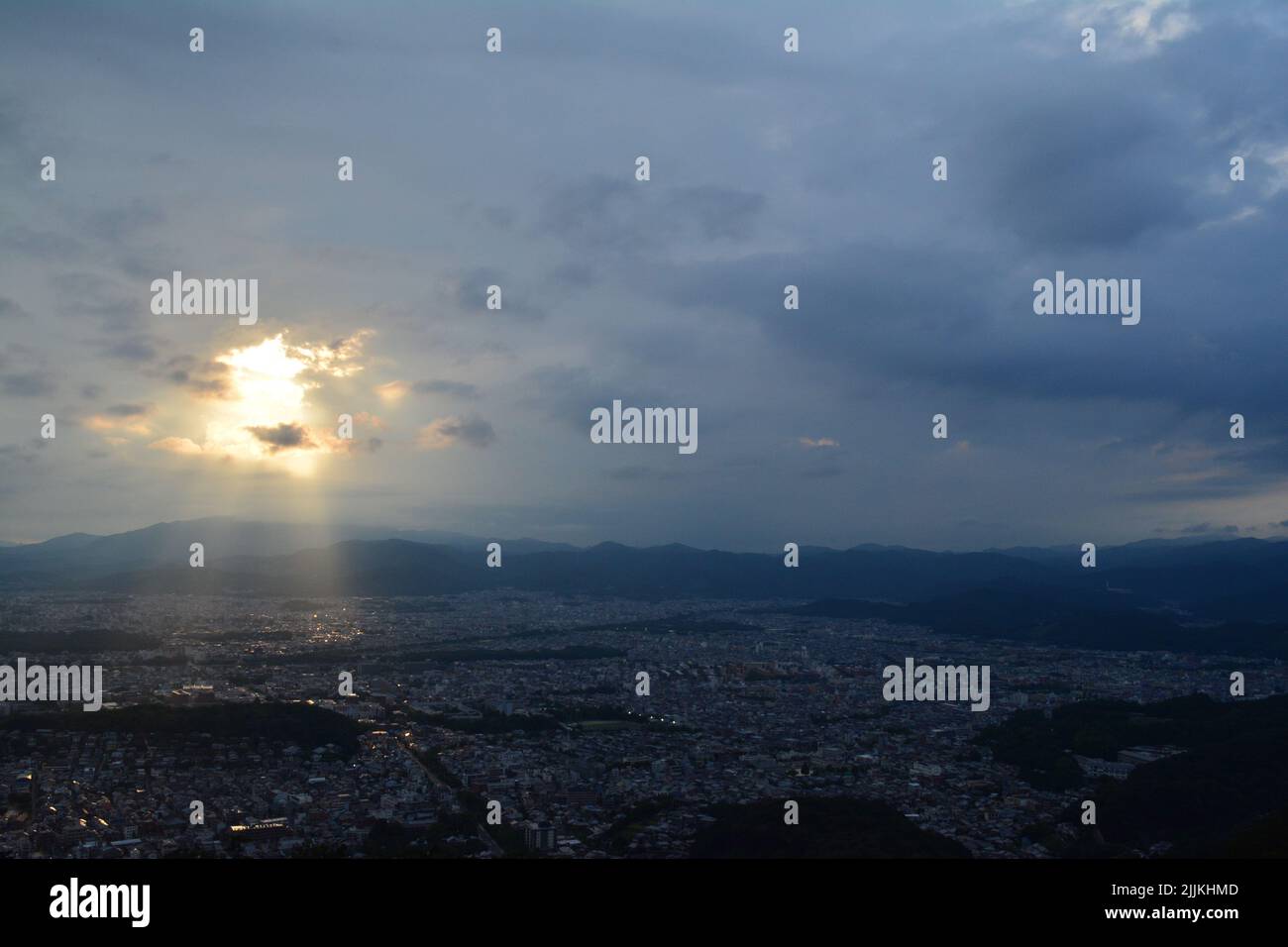 The Kyoto cityscape with sun rays through the clouds in Japan Stock ...
