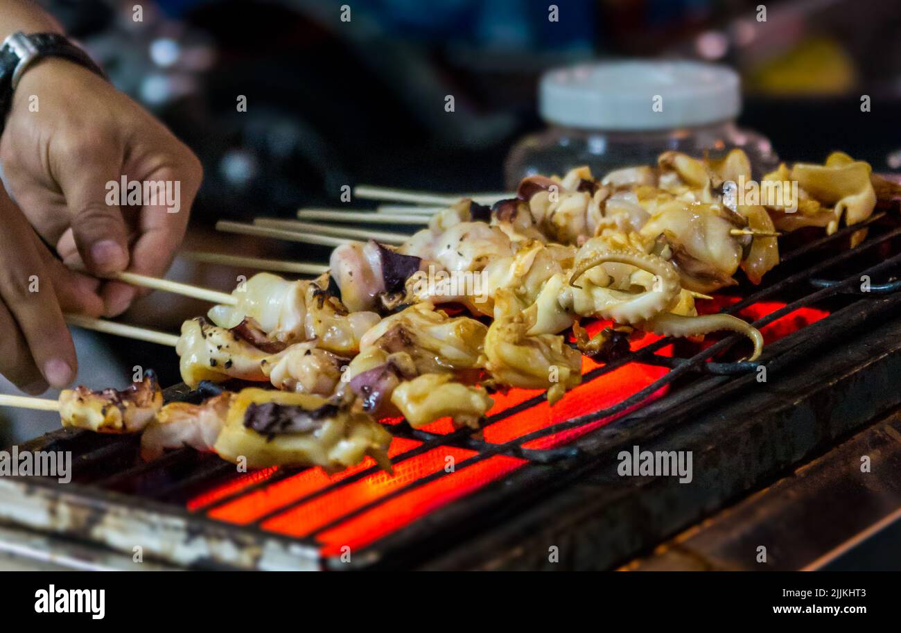 The process of the chef grilling Octopus in a restaurant Stock Photo ...