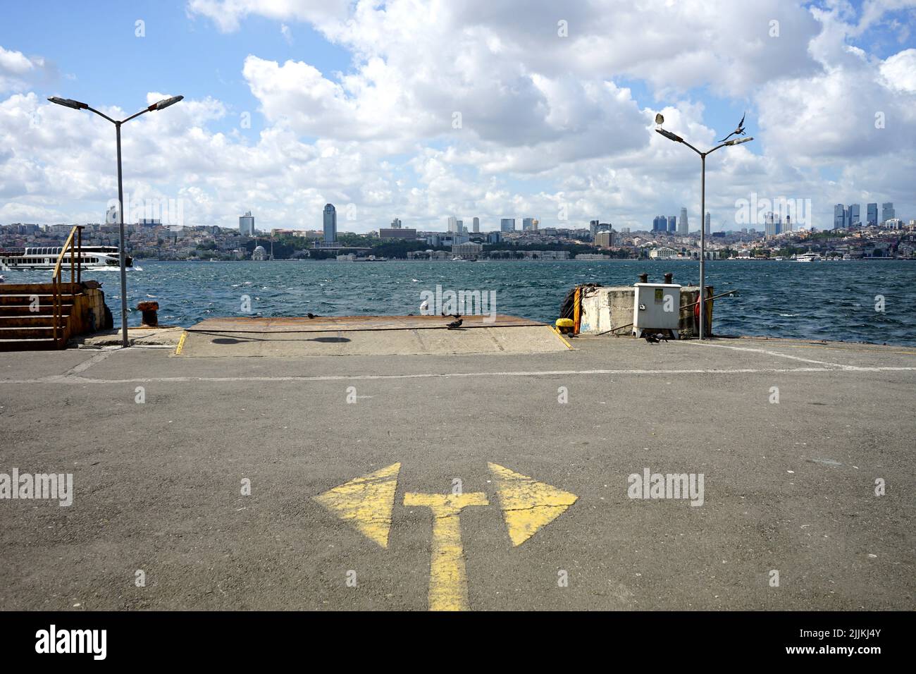 A beautiful view of riverside from the waterfront with many clouds in ...