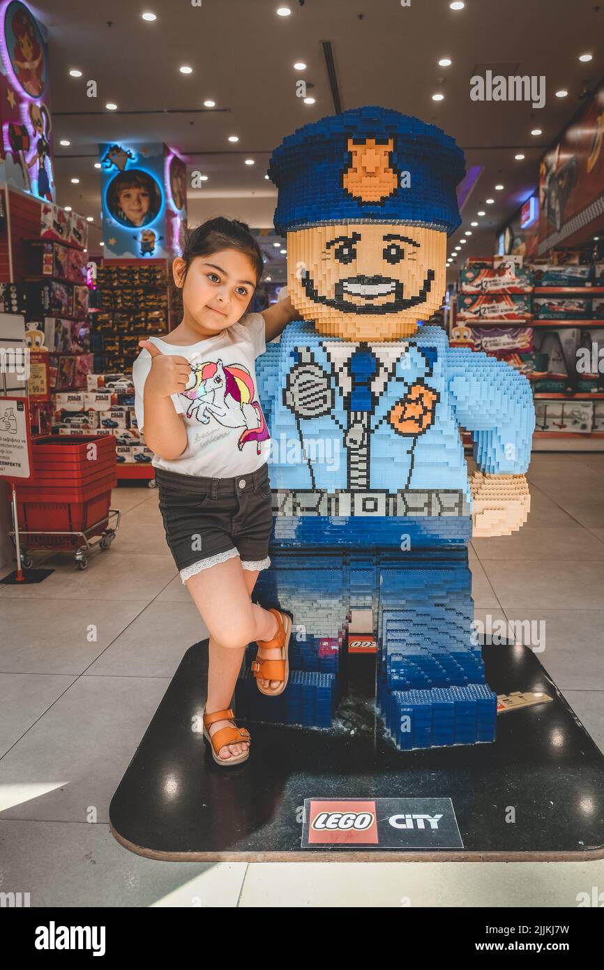 A little sweet girl with a Lego hero in a toy shop, Istanbul, Turkey ...