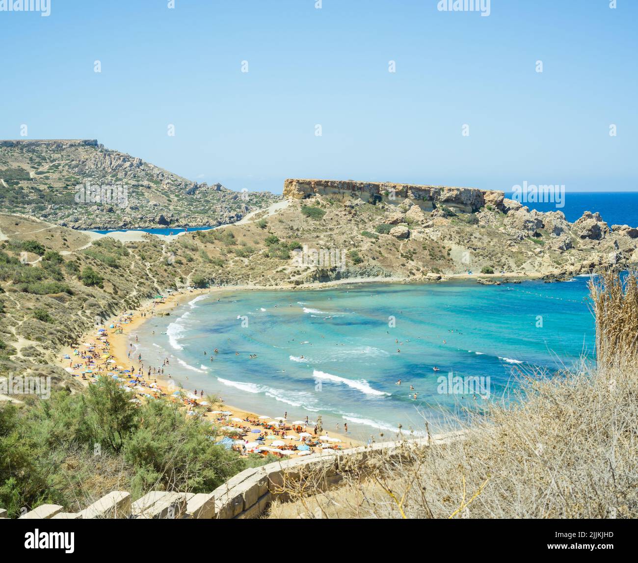 An aerial shot of the beautiful Riviera Beach in Malta under a clear ...