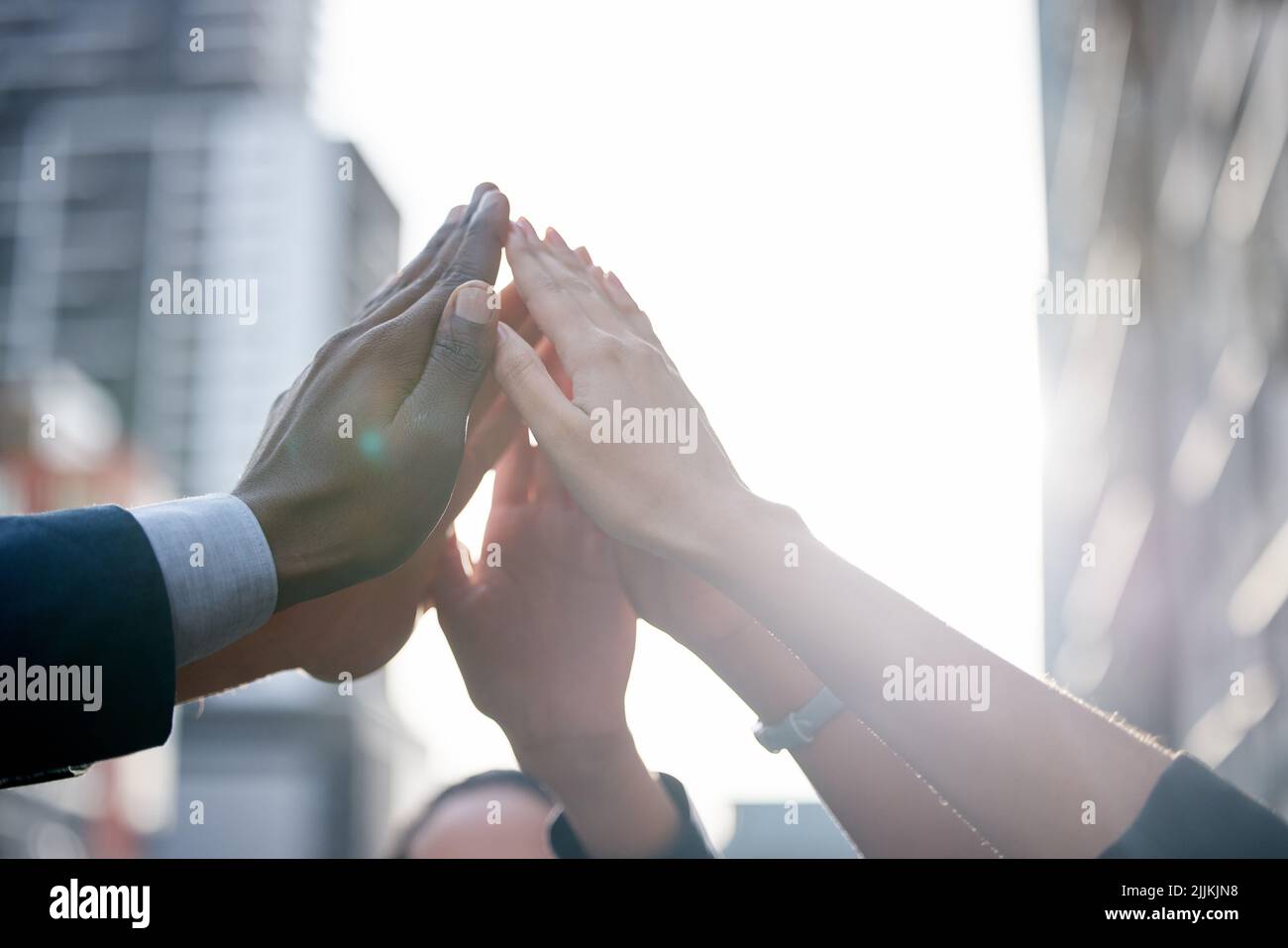 We grow by helping others up. a group of unrecognizable businesspeople ...