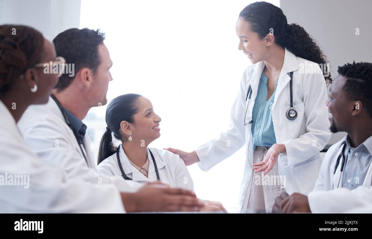 Make a list of those ideas. a group of doctors having a staff meeting ...